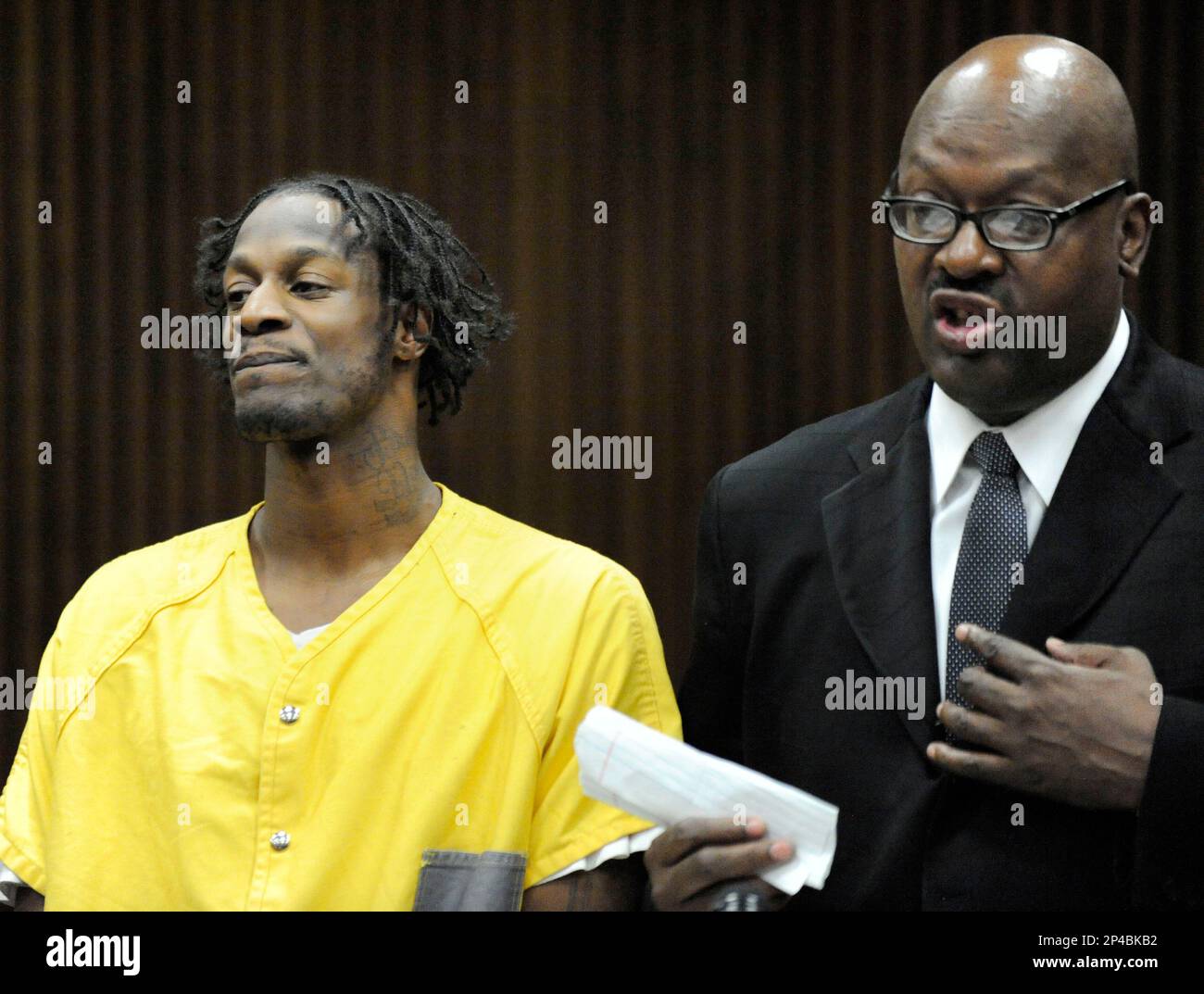 Wonzey Saffold, left, and his defense attorney Ray Paige stand before ...