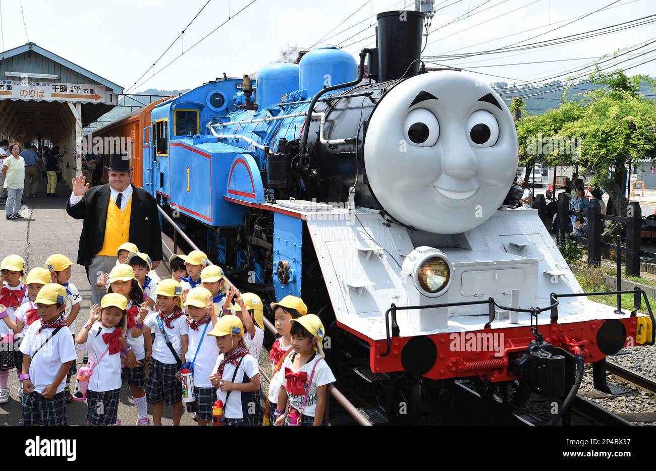 Childrene pose with Thomas the Tank Engine preparing for the test run ...