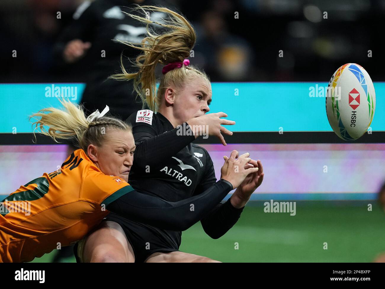 Australia's Maddison Levi, left, prevents New Zealand's Jorja Miller ...