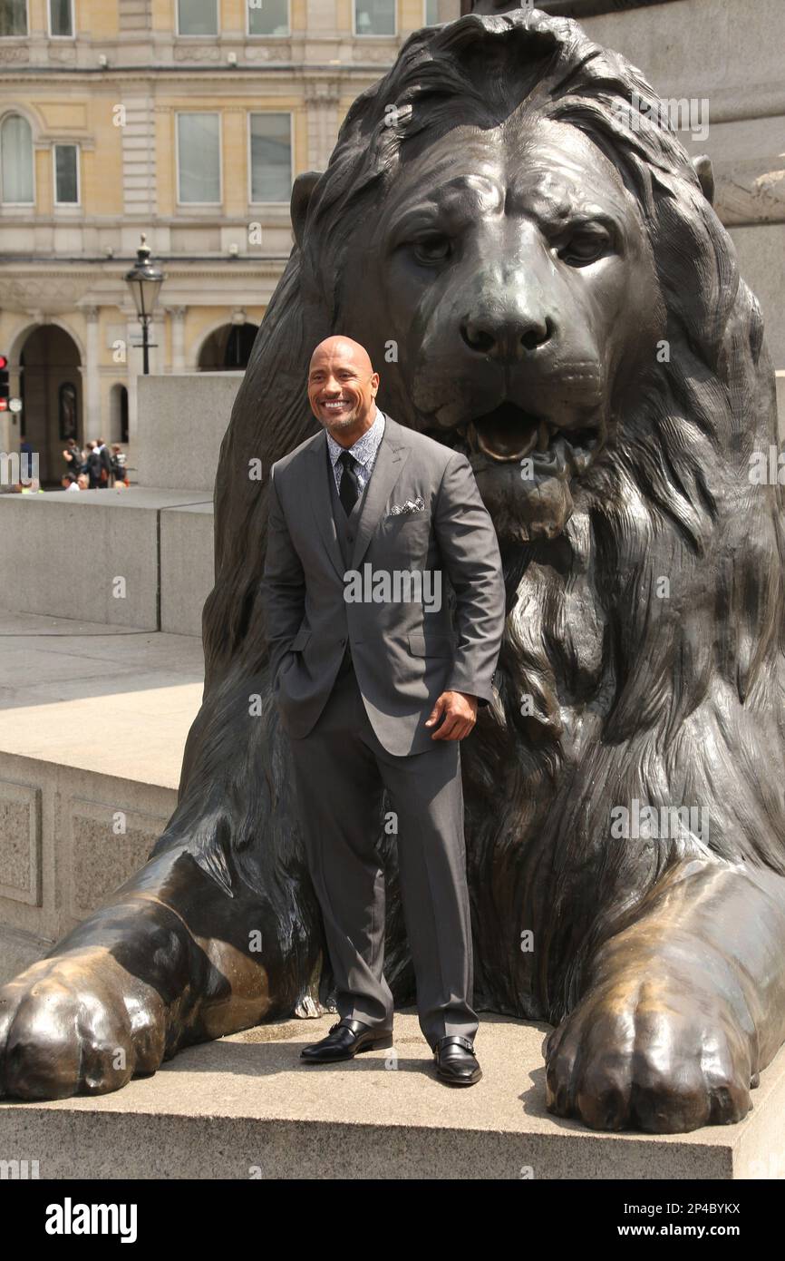 Dwayne Johnson, also known as 'The Rock', poses in front of one of the ...