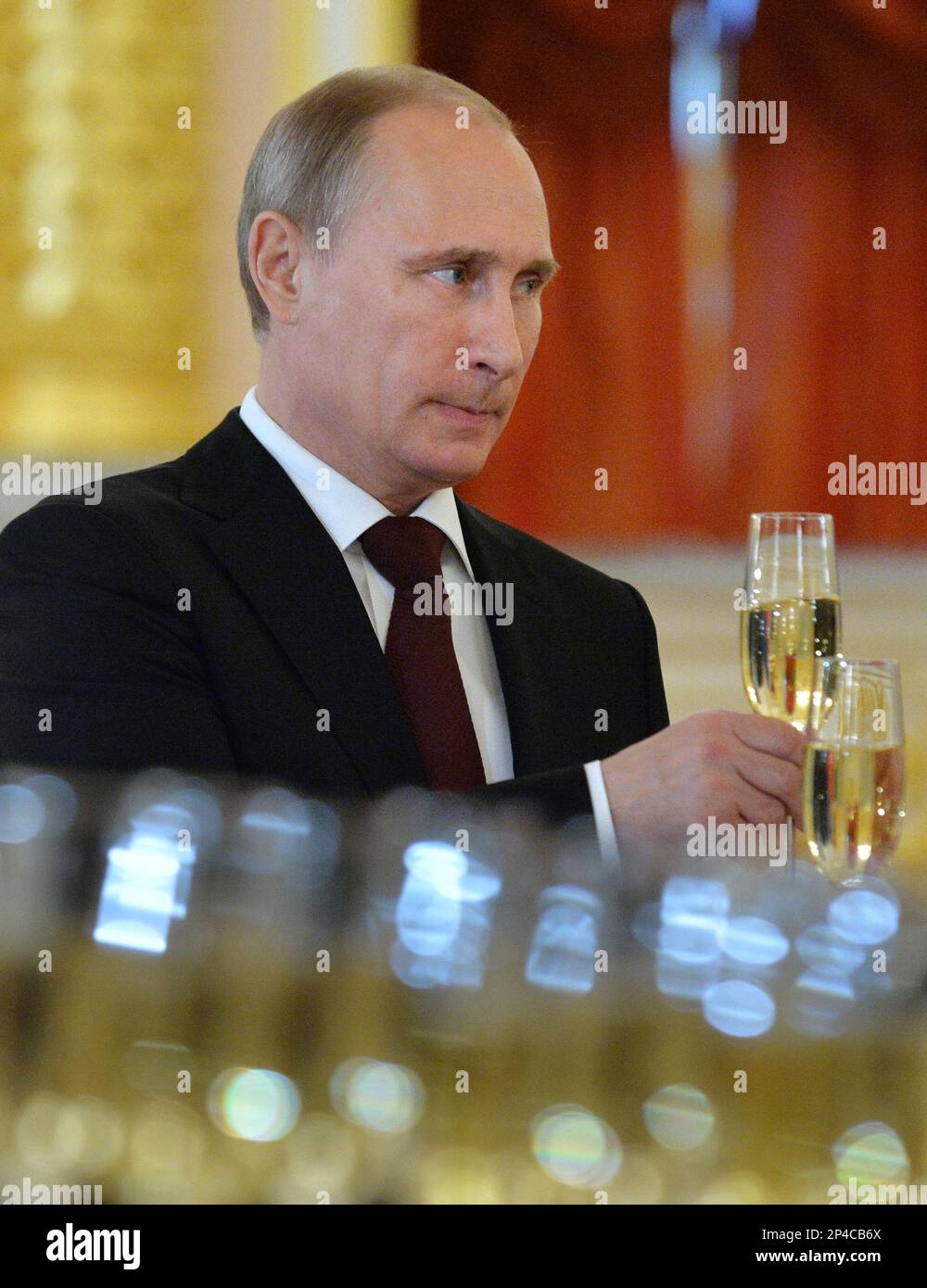 Russian President Vladimir Putin toasts at a ceremony of presentation ...