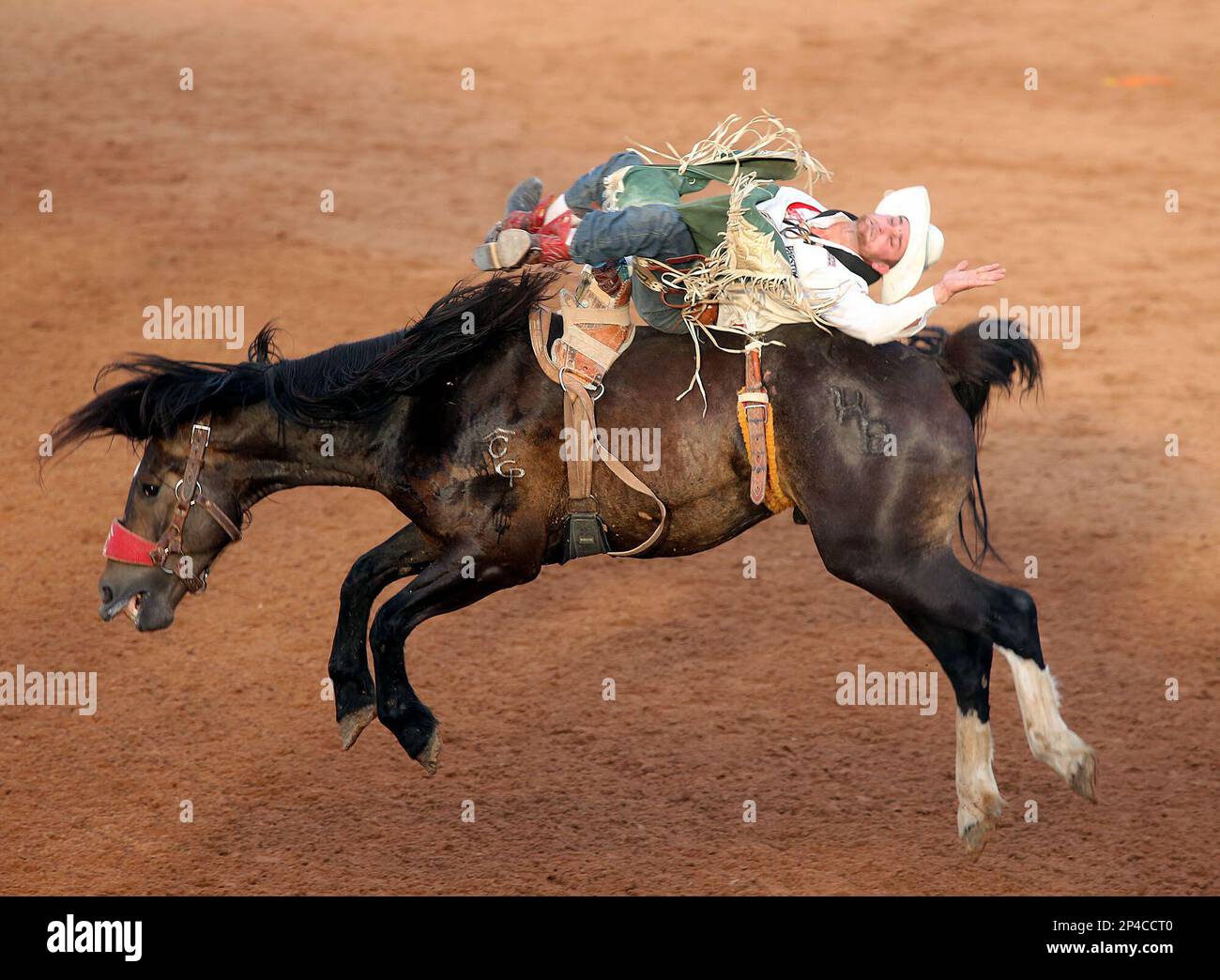 Jared Smith hangs on to a horse named Night Bells during the bareback ...