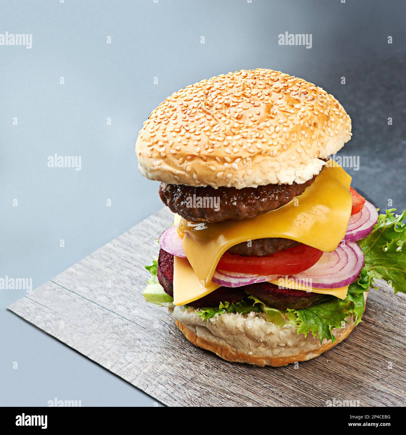 Triple the size, triple the flavor. a delicious triple decker hamburger ...