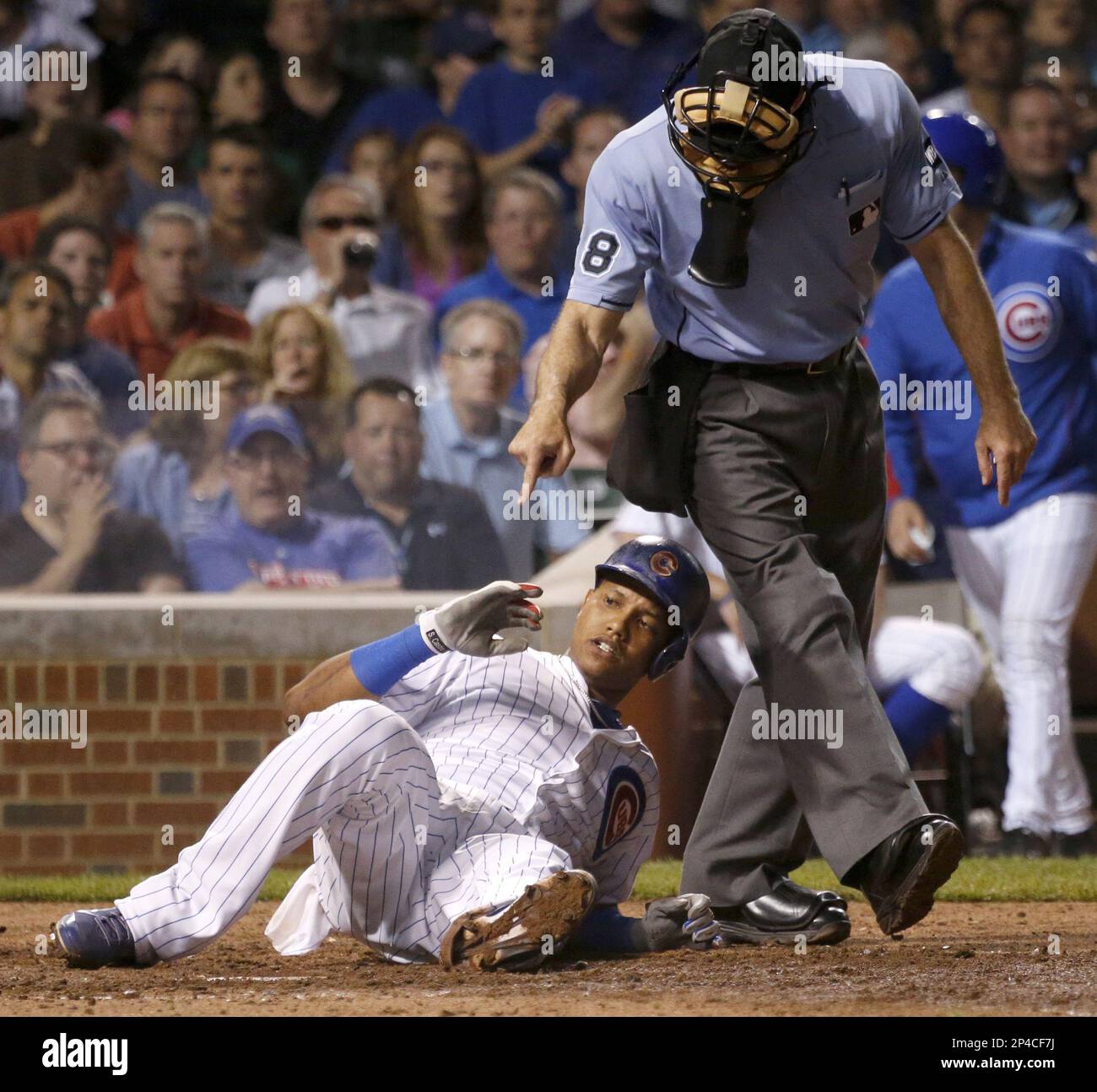 Home plate umpire Dan Iassogna points to Chicago Cubs' Starlin Castro's ...
