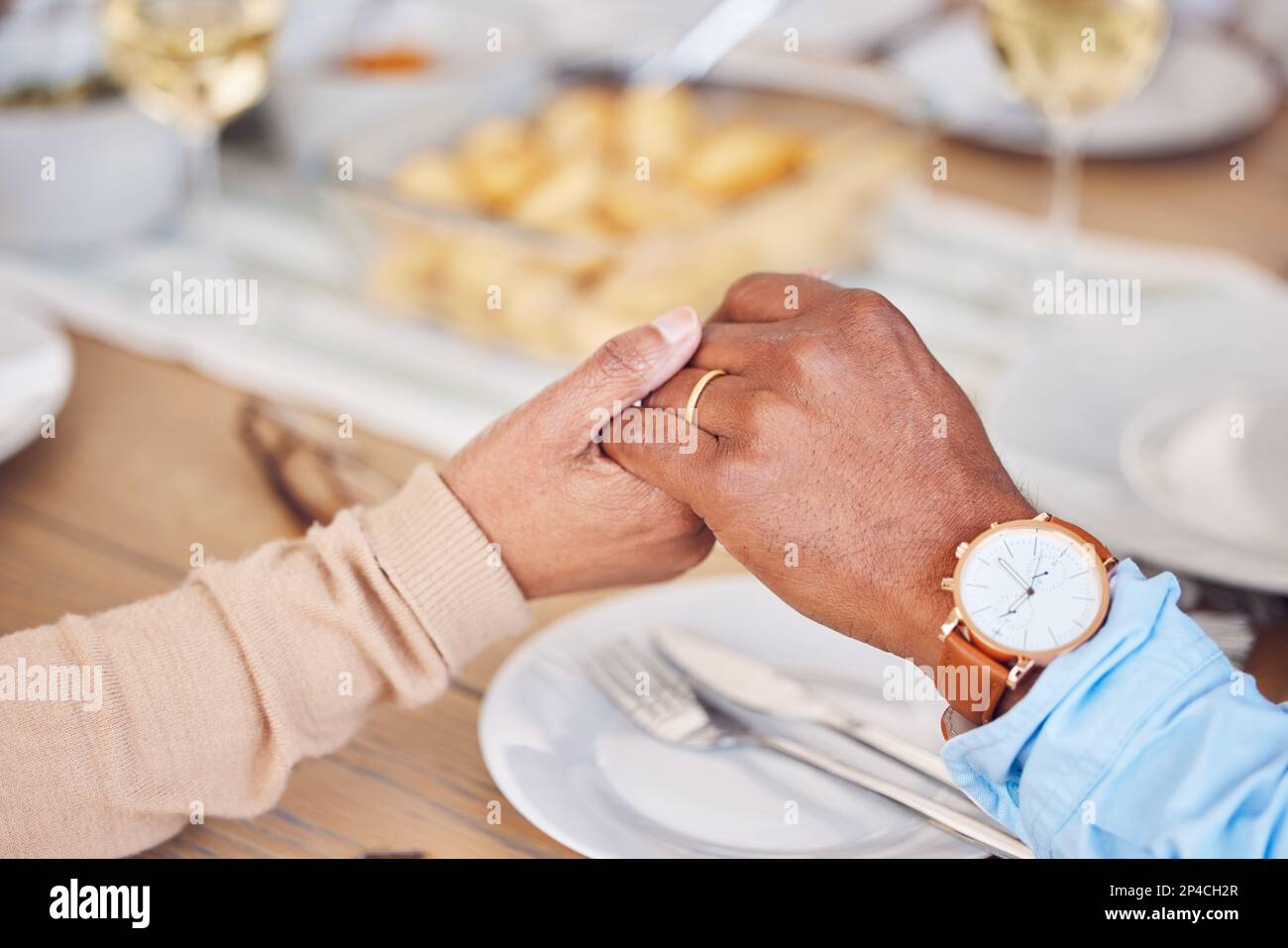 Holding hands, people and praying thanks on food, lunch or worship at ...