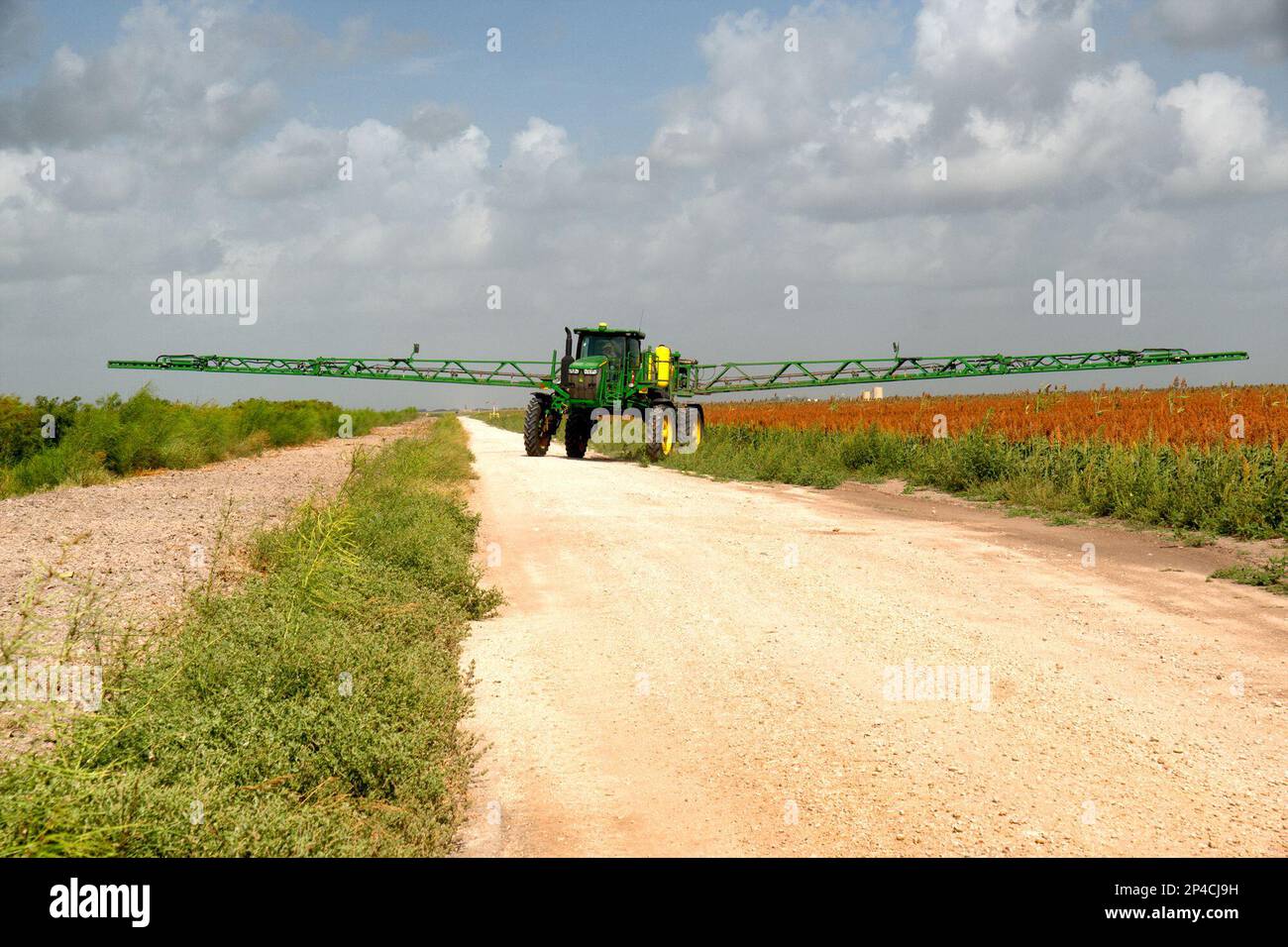 In this photo taken June 20, 2014 a sprayer driven by Christopher Plett ...