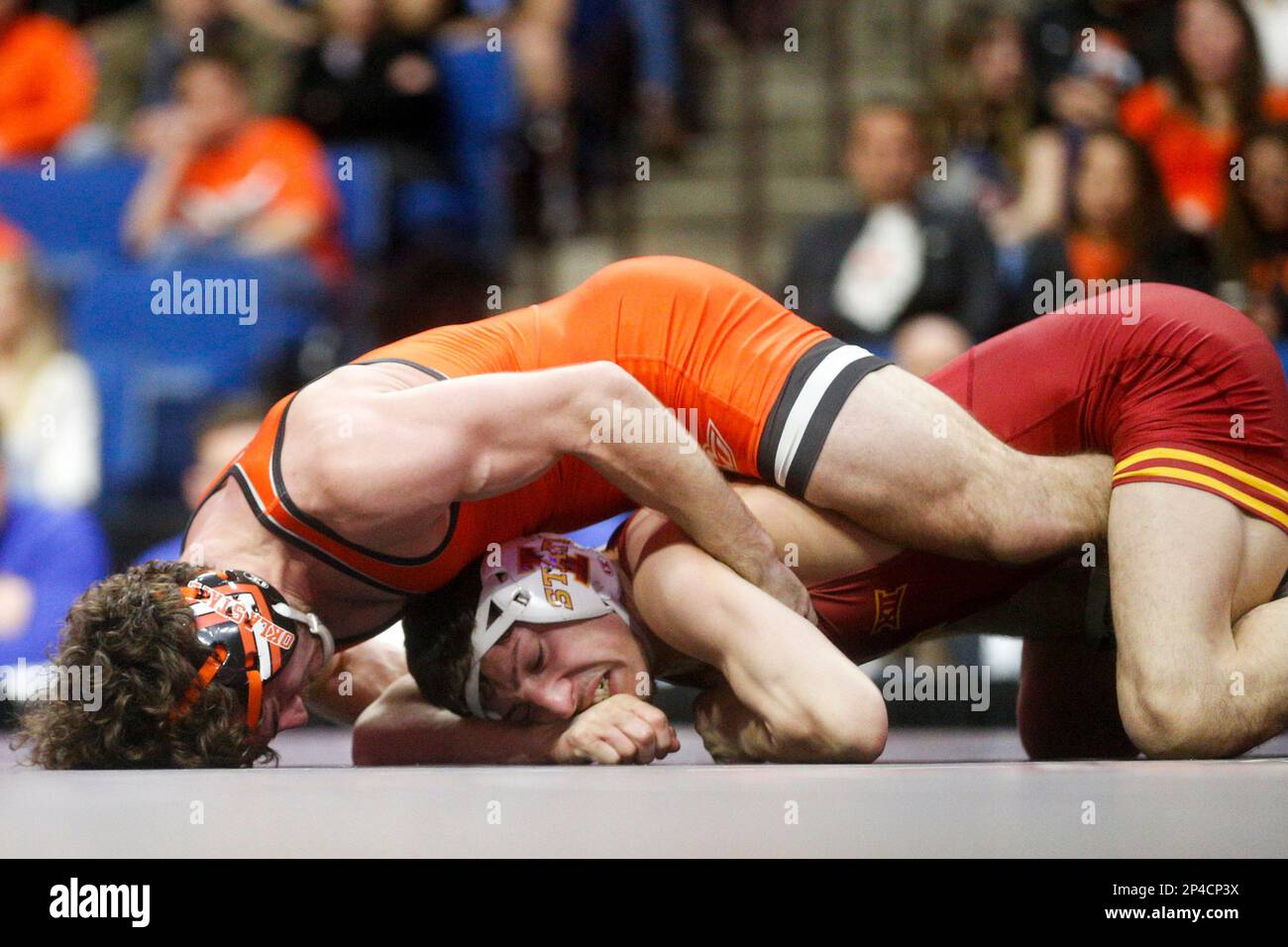 Oklahoma States Daton Fix Rides Iowa States Zach Redding During The