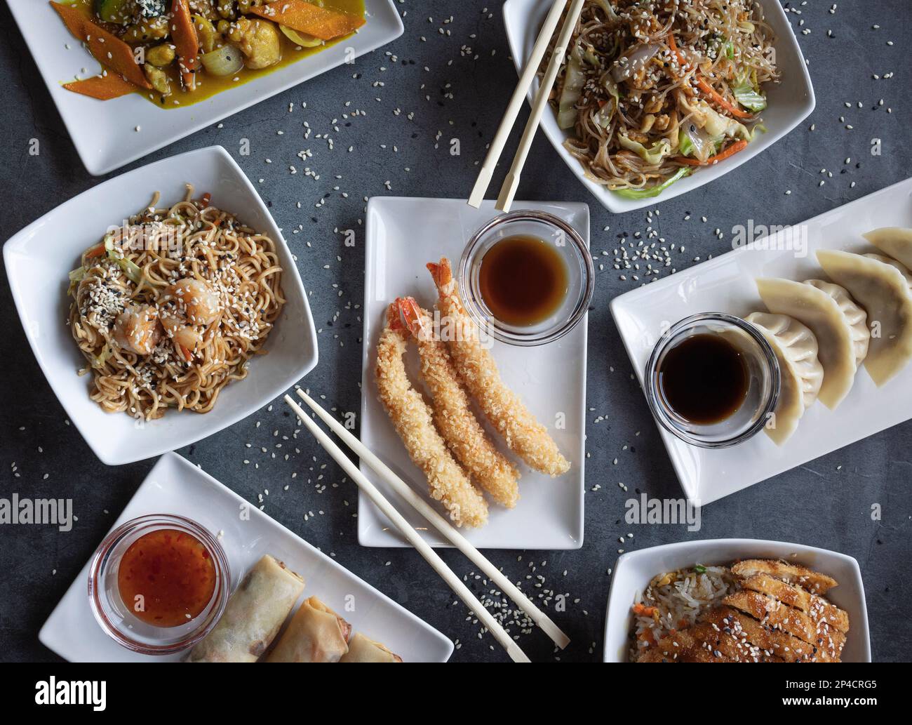 Variety of Chinese food on the restaurant table Stock Photo - Alamy