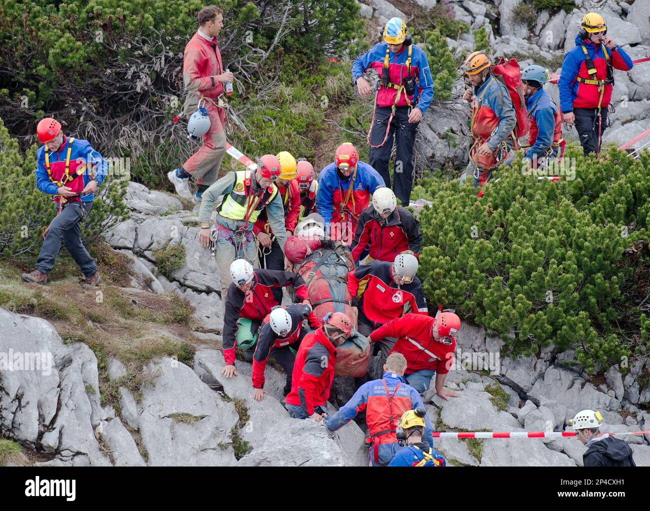 Mountain rescuers carry cave researcher Johann Westhauser , center, out ...