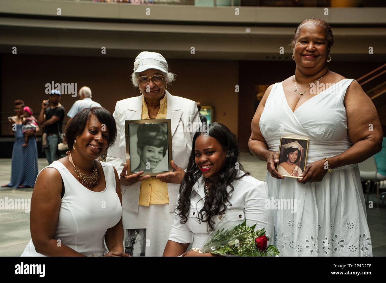 Imani Bullock, seated right, poses with relatives after becoming the ...