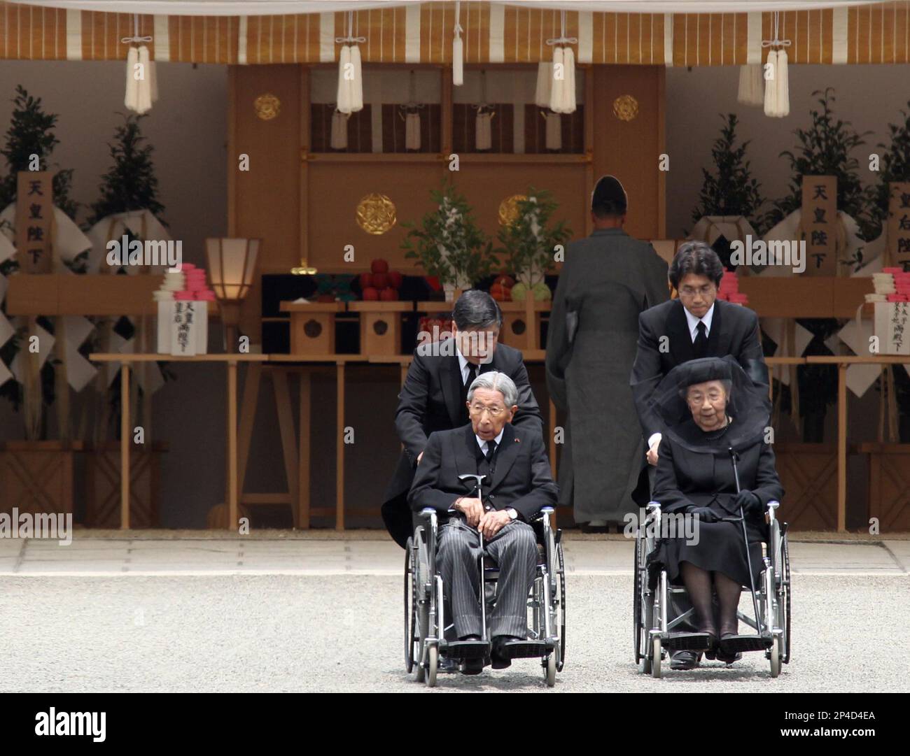Prince Mikasa (L) and Princess Yuriko in wheelchair, leave after ...