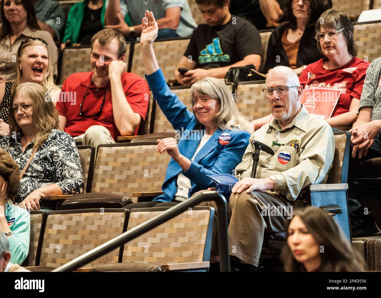Karen Sommers raises her hand after making a comment during the GOP ...