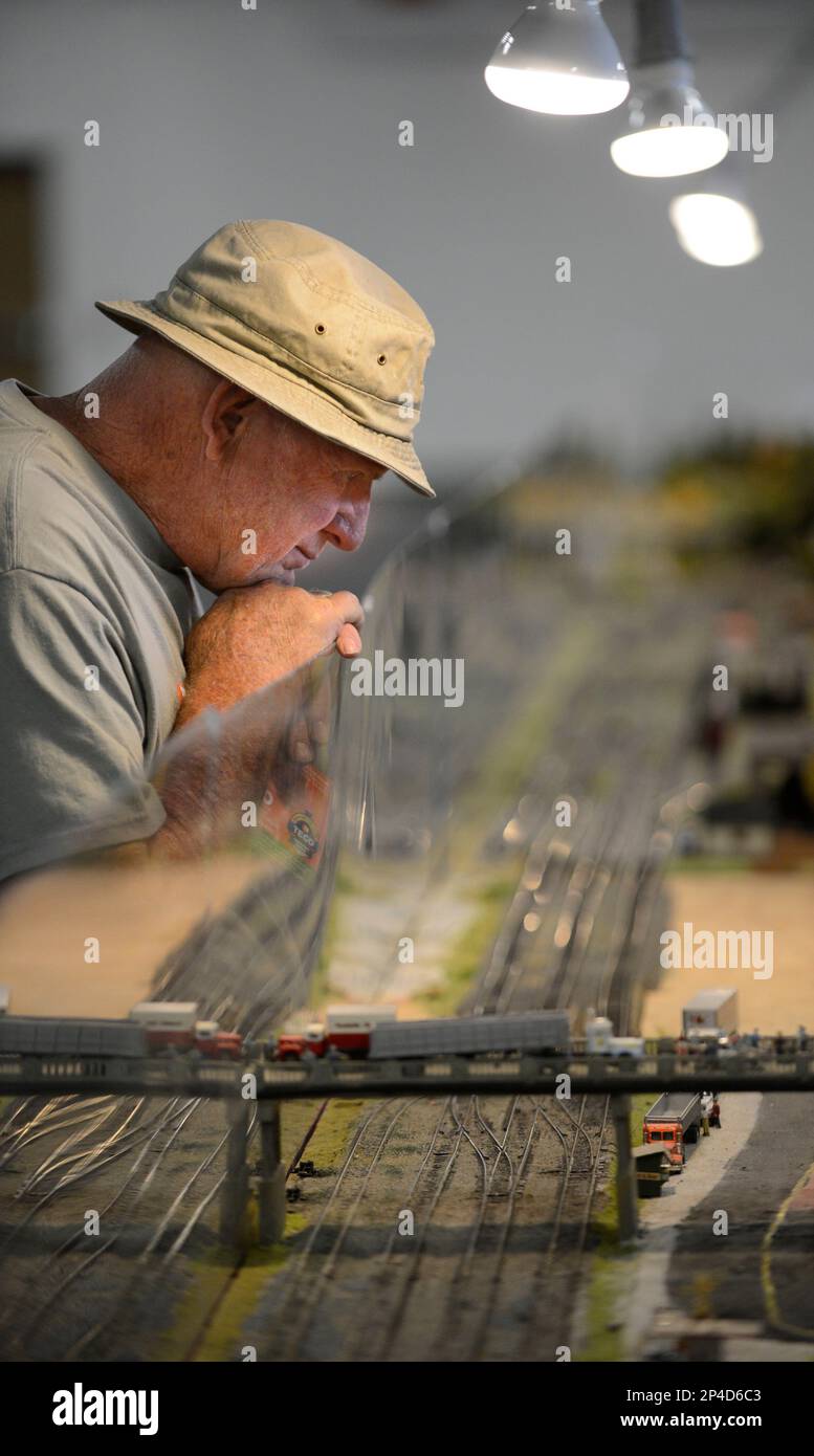 Clay Wright of Colorado Springs, Colo., eyes an HO scale display at the ...