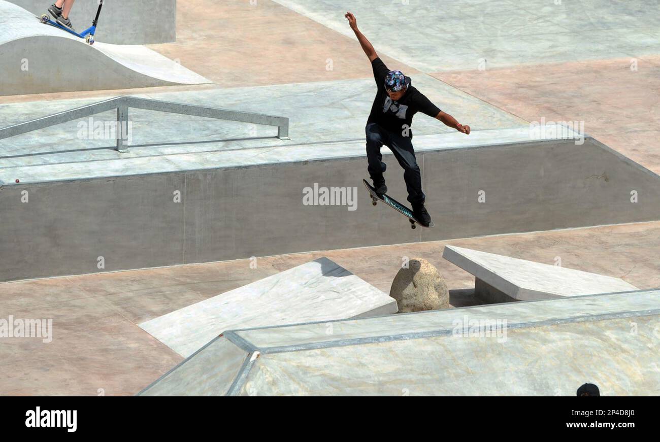 Skateboarder Jon Rivas, 20, hits the ramp, Saturday, June 14, 2014 ...