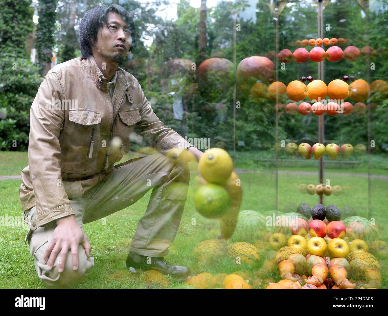 Japanese artist Reijo Wada looks at his work 'Freeze' at the exhibition ...