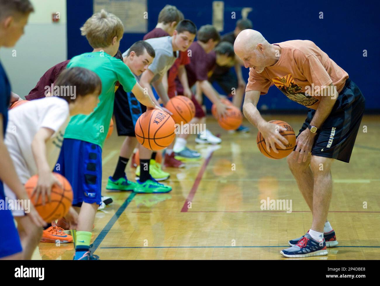 Greg Brittenham leads a dribbling exercise during a three-day camp at ...