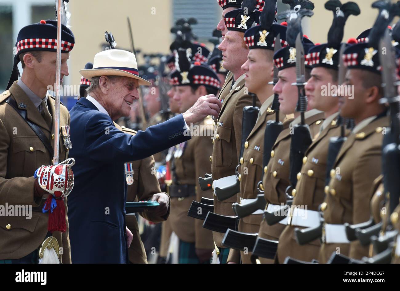 Prince Philip, Duke of Edinburgh, second left, presents decorations to ...