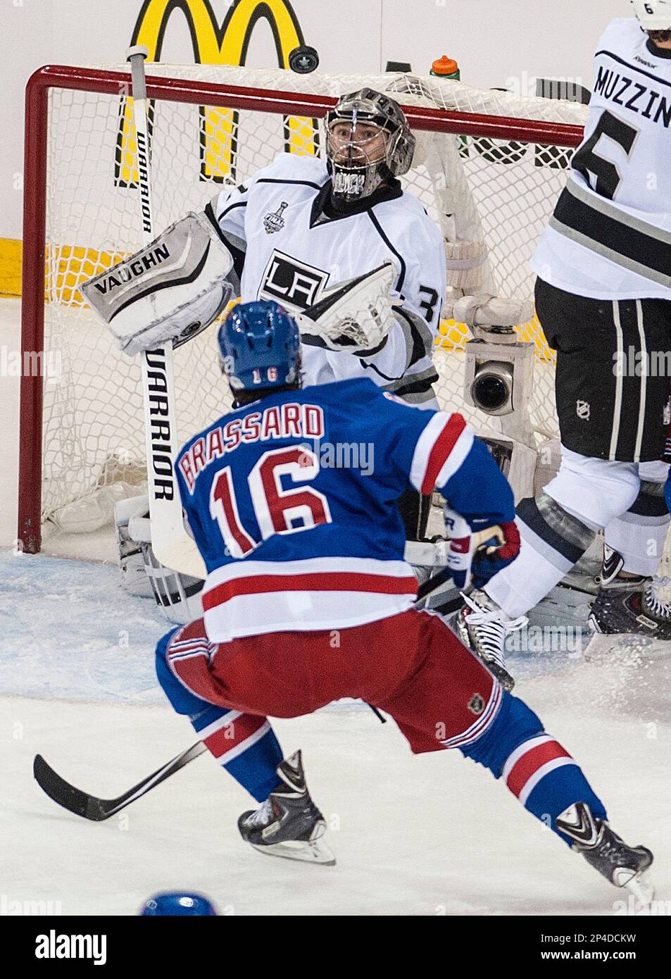 Kings goalie Jonathan Quick catches a flying puck as Derick Brassard of ...