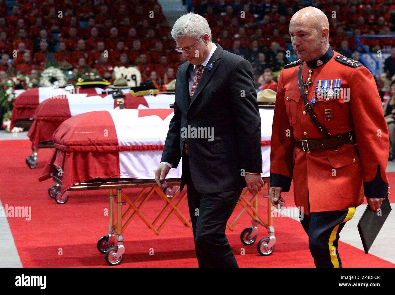 Prime Minister Stephen Harper, left, and RCMP Commissioner Bob Paulson ...
