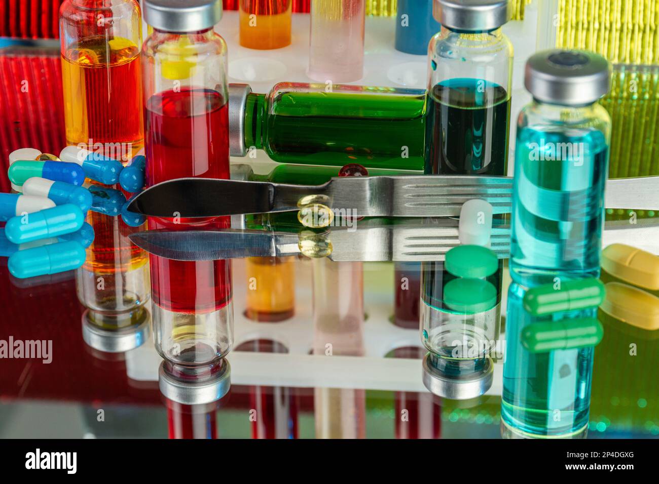 Close up colored drug vials with medicine solution. Lab drugs on ...