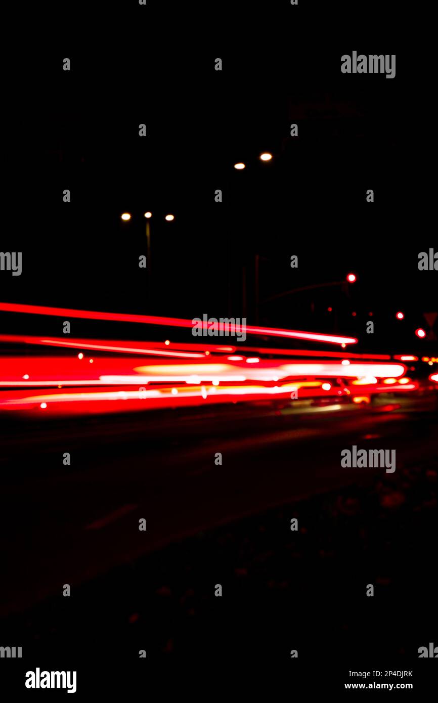 Lights of cars at night. Street line lights. Night highway city. Long ...