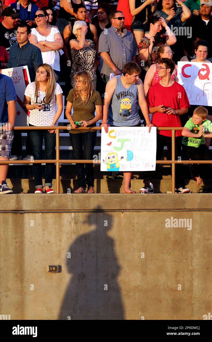Attendees of the Odessa High School commencement ceremony watch as the ...
