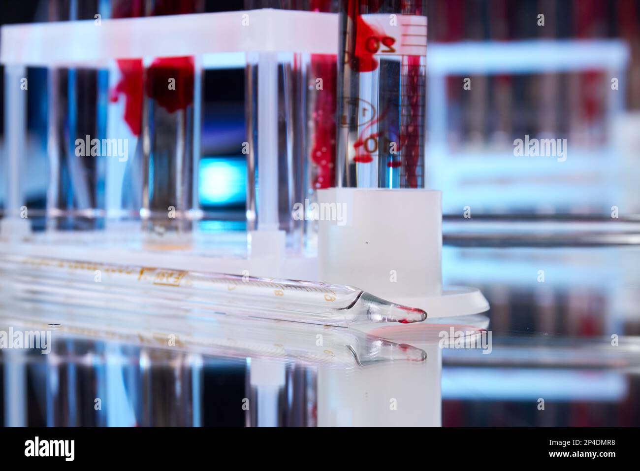 Laboratory glass pipette and test tubes with blood. Lab equipment for ...