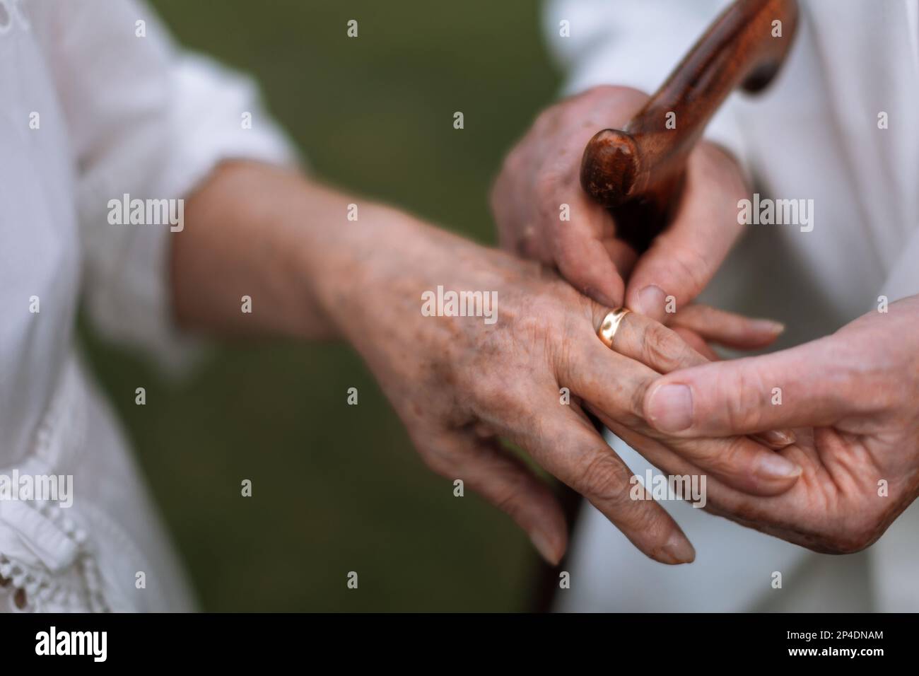 Older hands and wedding rings hi-res stock photography and images - Alamy