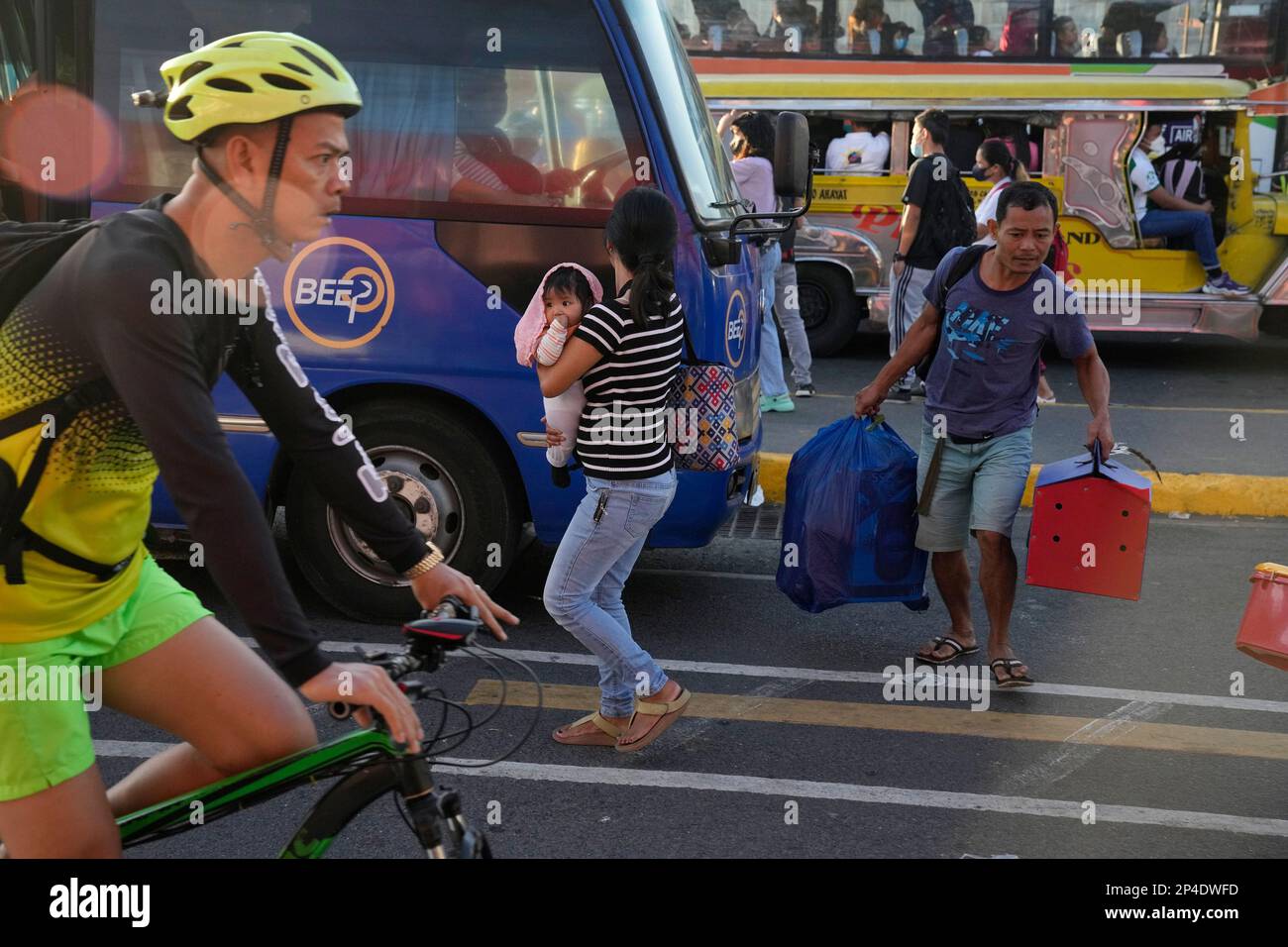 Commuters wait for a ride during a transport strike in Quezon city ...