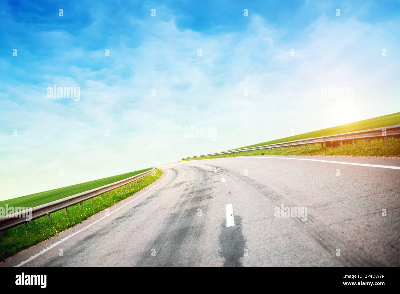 Summer road, sky, sun and clouds background Stock Photo - Alamy