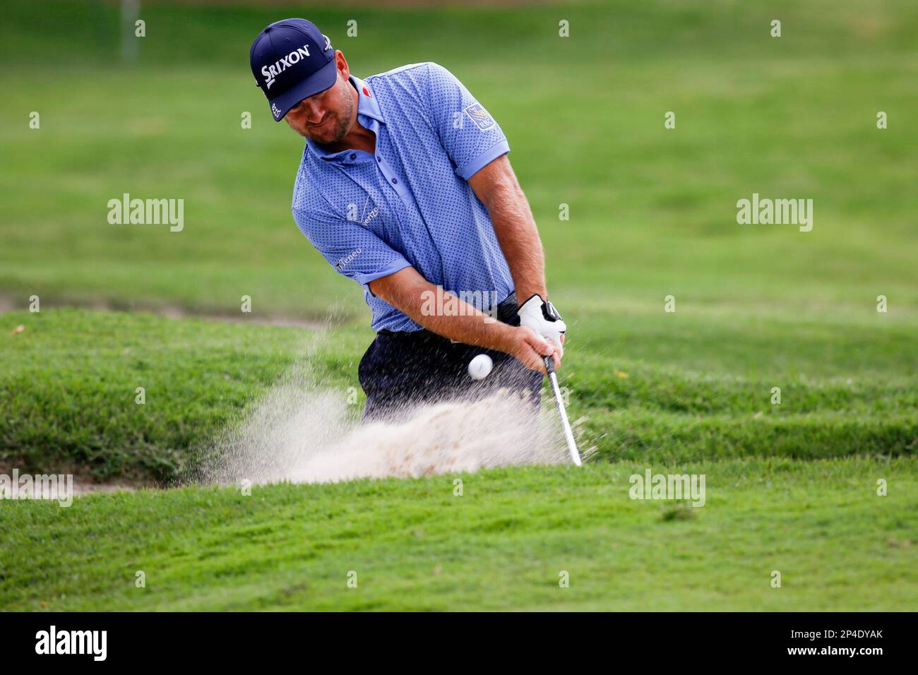 Graeme McDowell hits his way out of a bunker on the 17th hole during ...