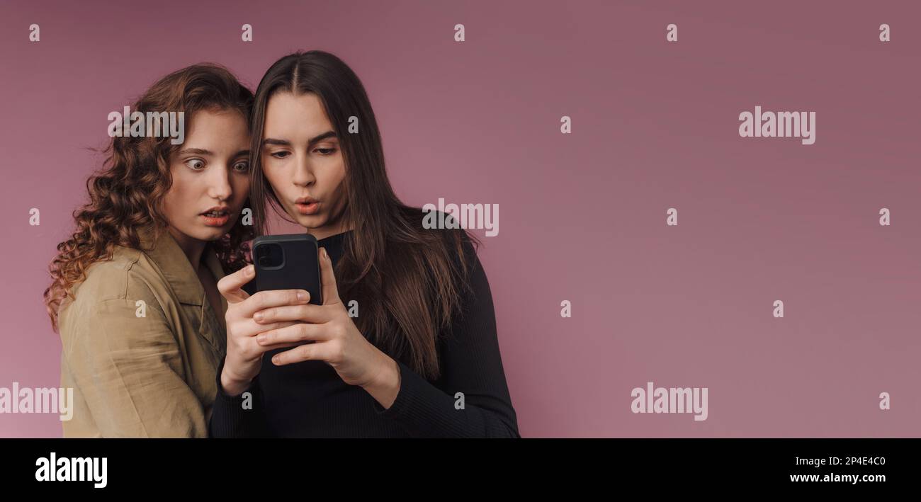 Portrait of two young happy girls, studio shoot Stock Photo - Alamy