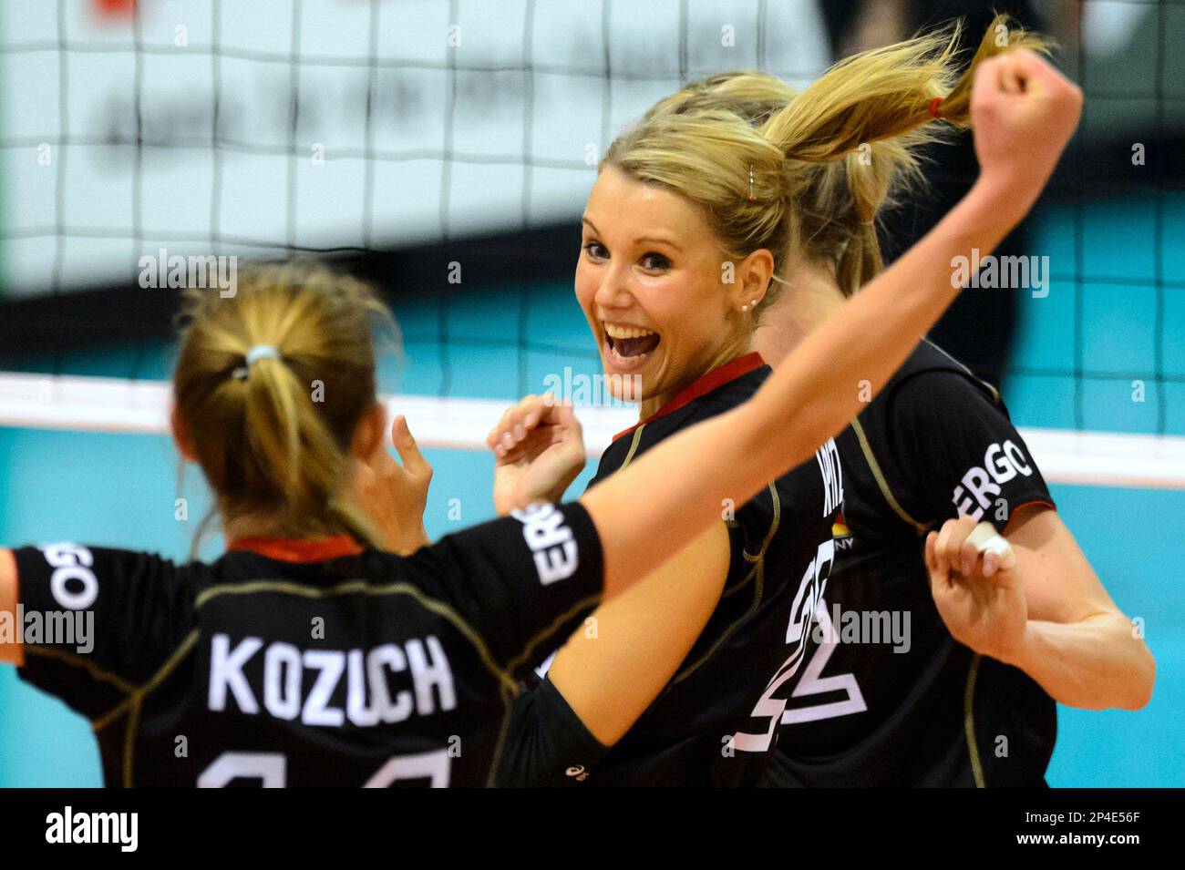 Germany's volleyball player Mareen Apitz, center, celebrates with ...