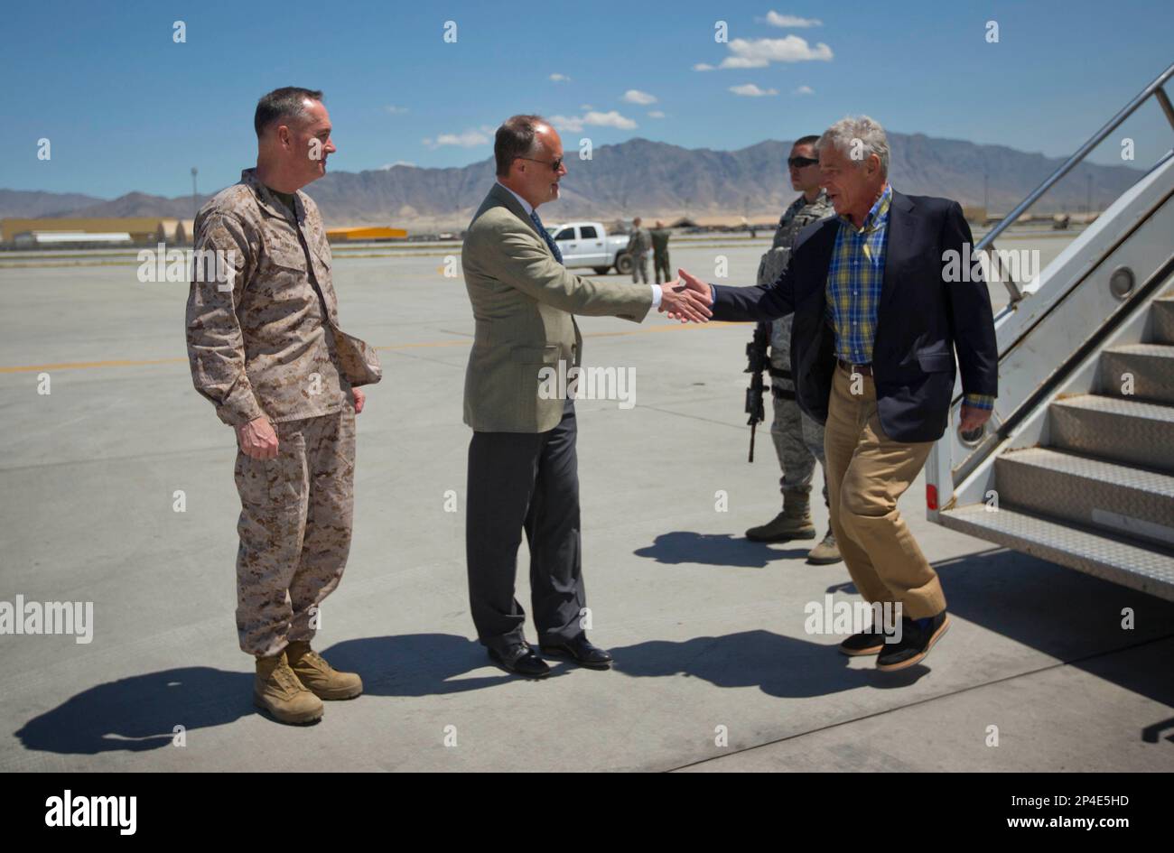 U.S. Defense Secretary Chuck Hagel, right, is greeted by U.S ...