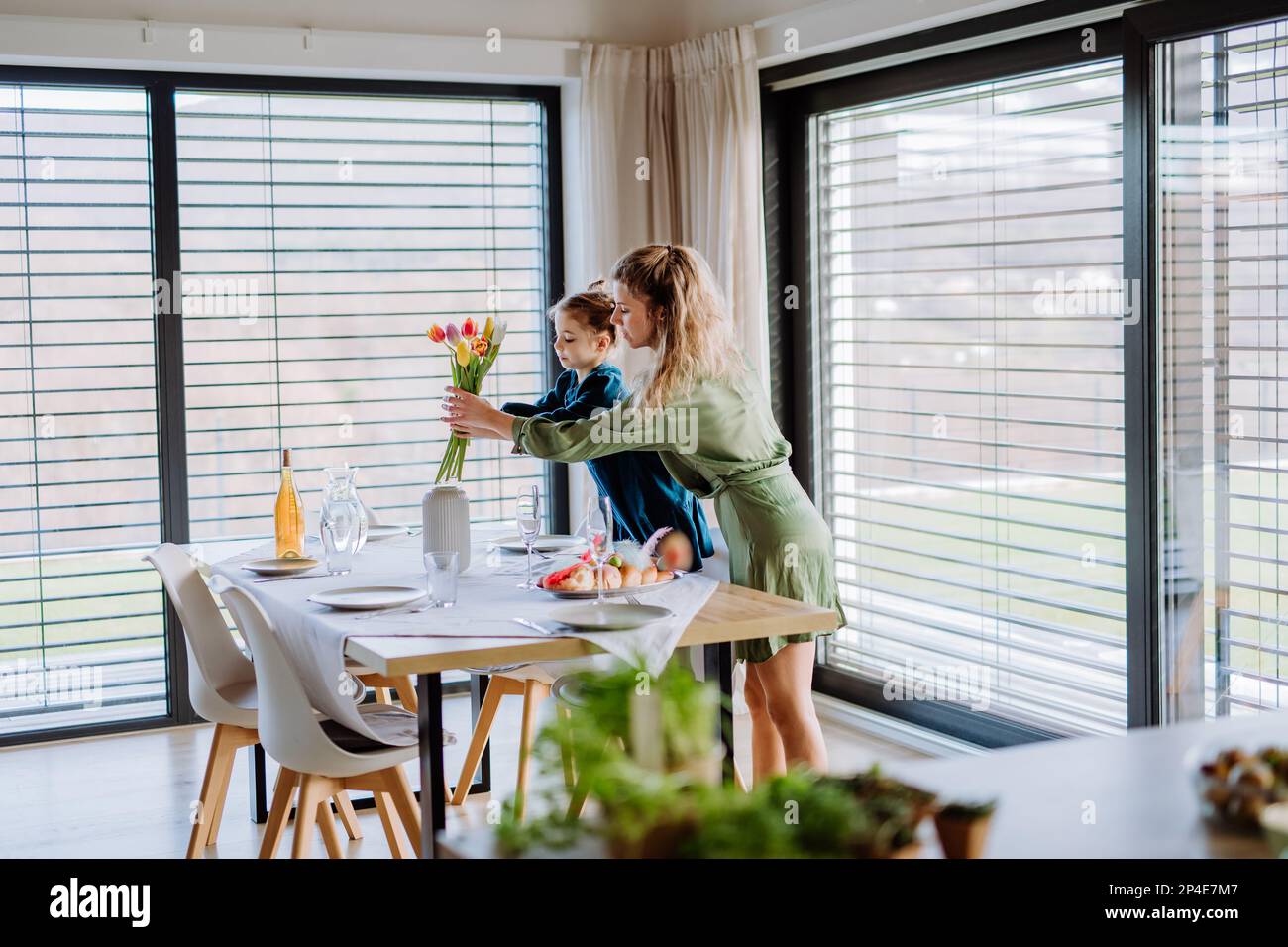 Little girl with her mother celebrating spring Stock Photo - Alamy