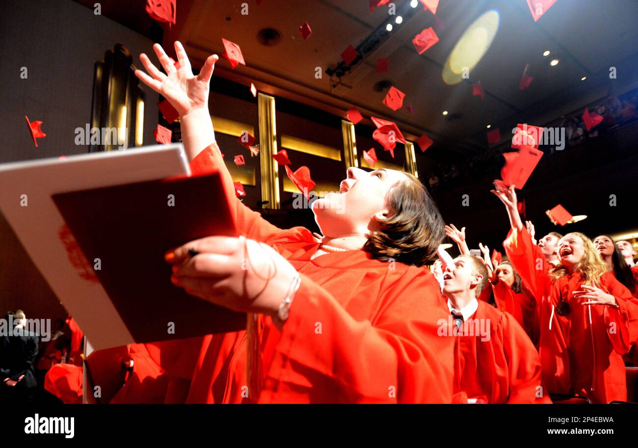 Holy Redeemer graduates throw their hats in the air, Wednesday, May ...