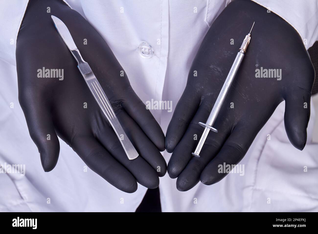 Close up doctors hands in gloves holding tools for cosmetic surgery ...