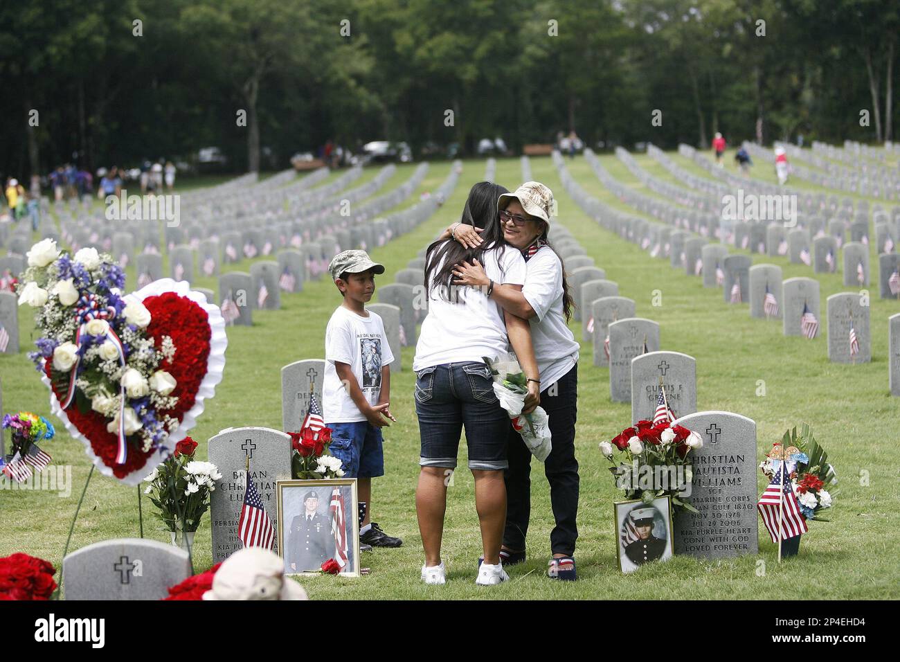 Bryan Christian Luckey Jr., left, looks on as his mother Catherine ...