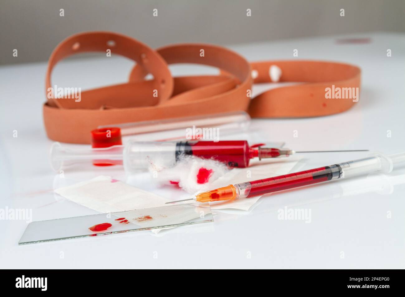 Close up syringes filled with red blood. Glass sheet test Stock Photo ...