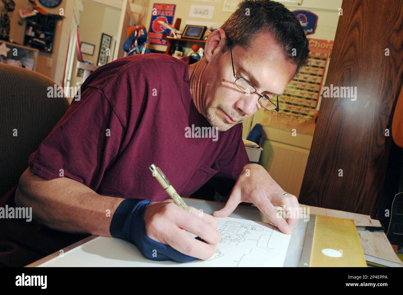 Cartoonist Todd Clark draws his nationally syndicated comic strip “Lola ...