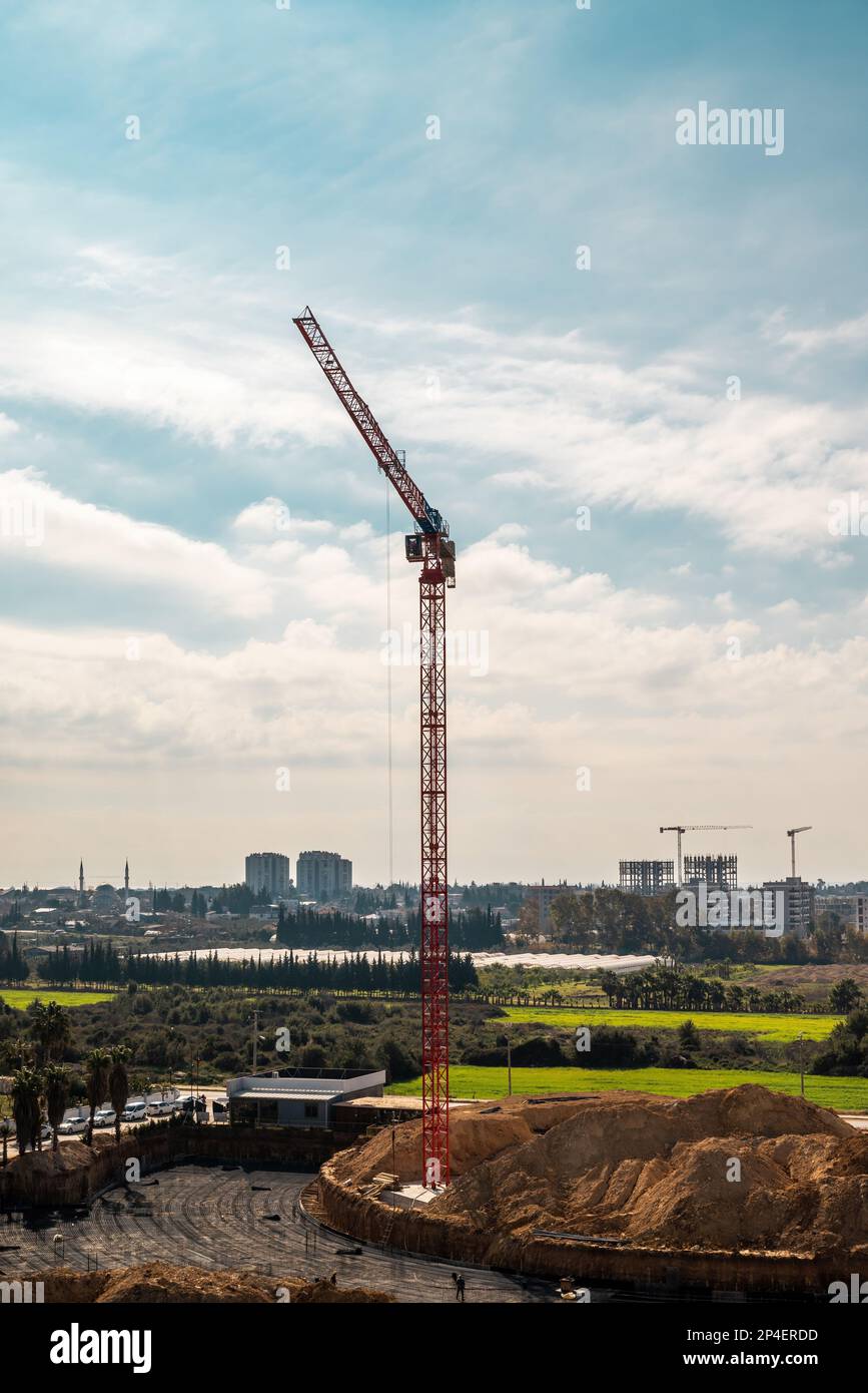 Construction crane working on large construction site Stock Photo - Alamy