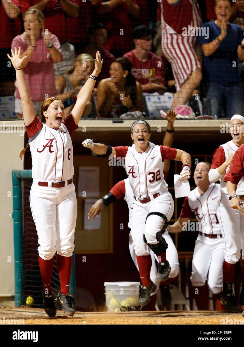 Alabama's Jordan Patterson (6) and other players cheer from the dugout ...