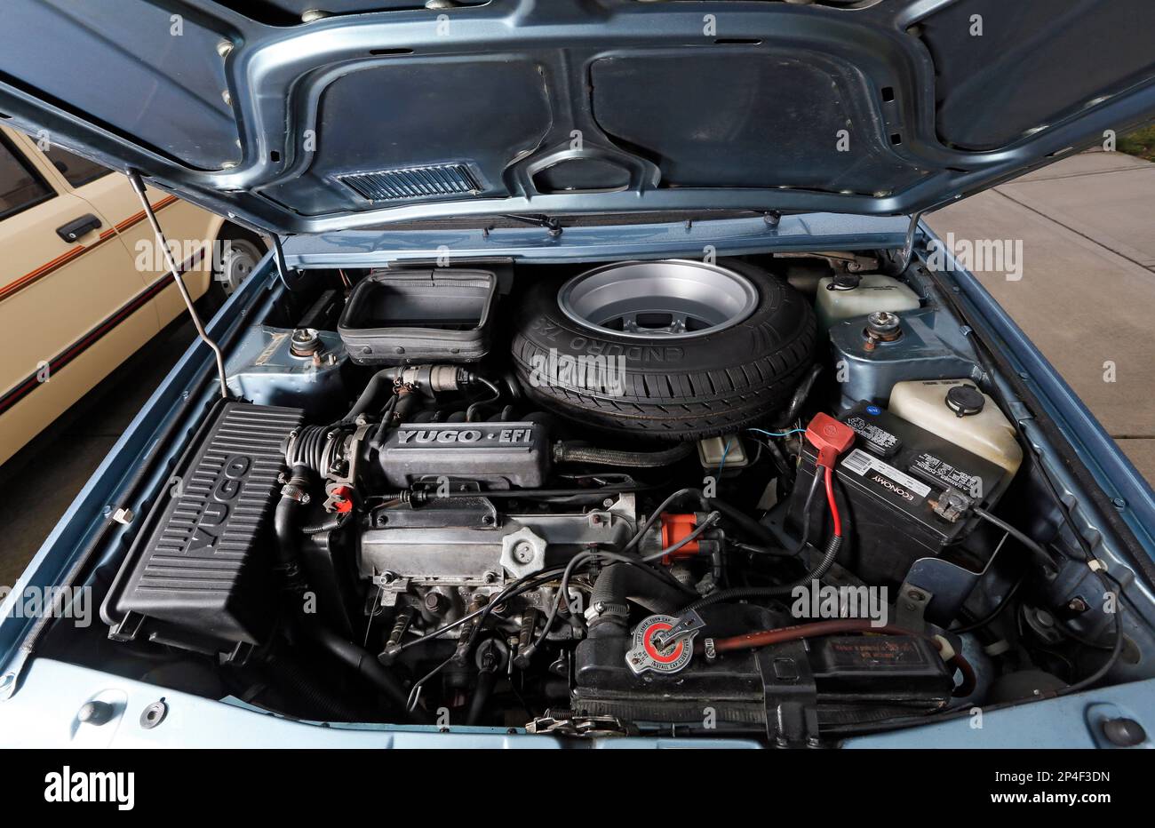 This April 2, 2014 photo shows a spare tire located under the hood of ...