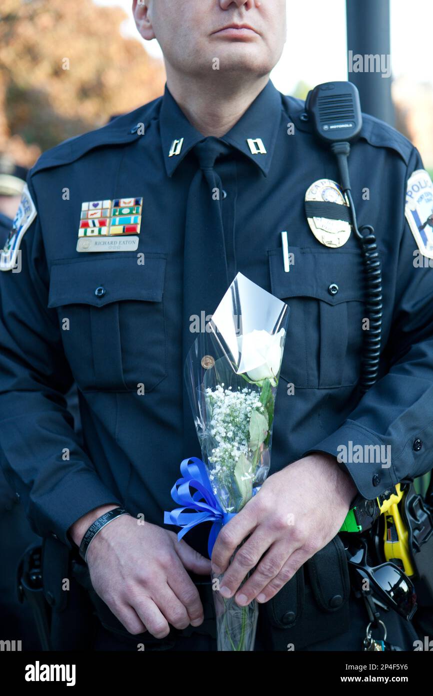 During a ceremony for fallen law enforcement officers, a policeman ...