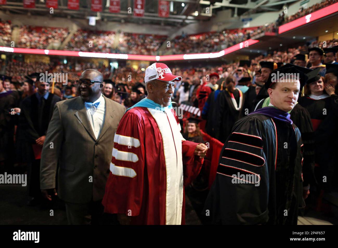 Bill Cosby, center, enters the Liacouras Center during graduation ...