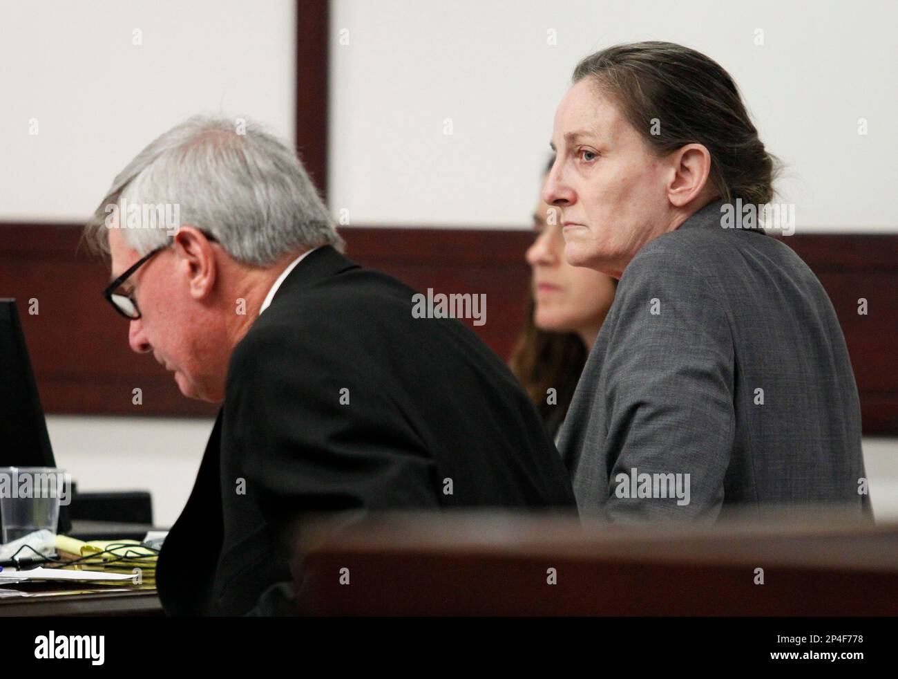 Julie Schenecker, right, listens to her defense attorney give closing ...