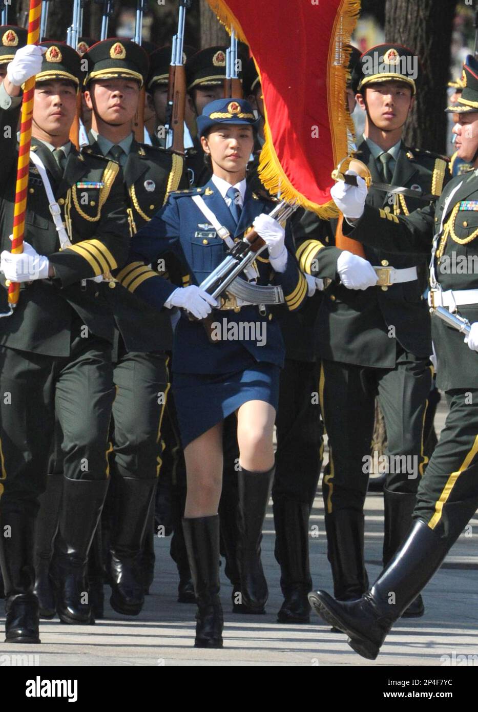 Chinese female (C) People’s Liberation Army honour guards parade with ...
