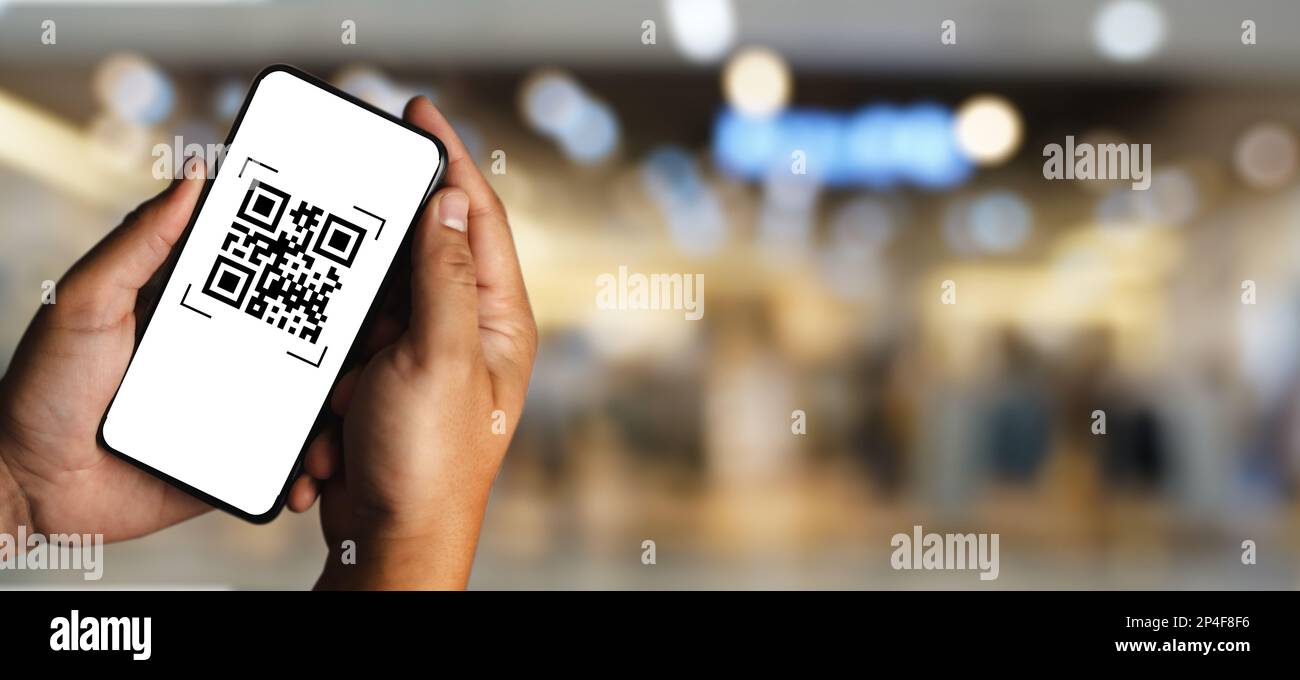 scanning QR codes with a mobile phone application and paying for goods ...