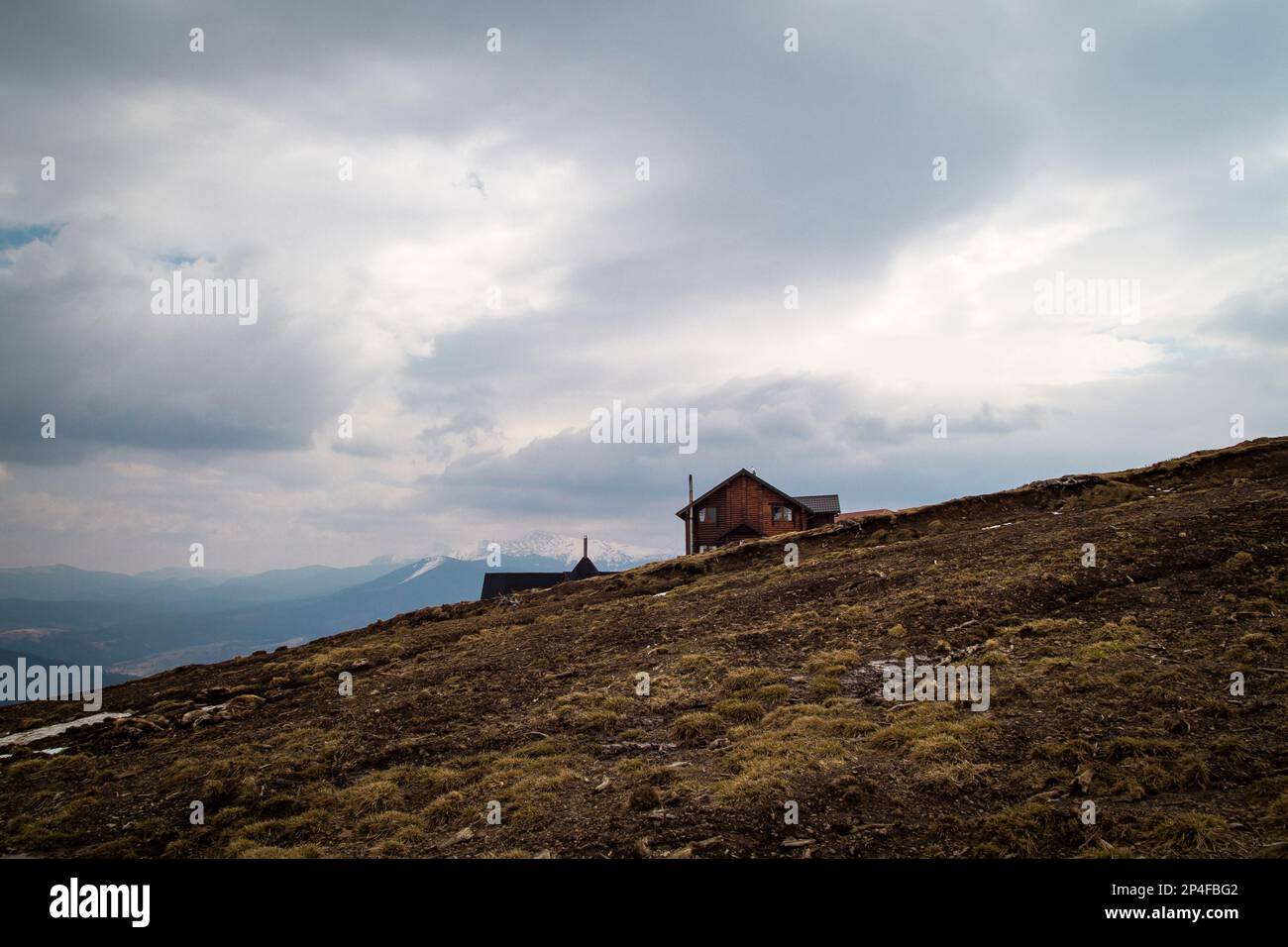 Wooden house on steep mountain slope landscape photo. Nature scenery ...