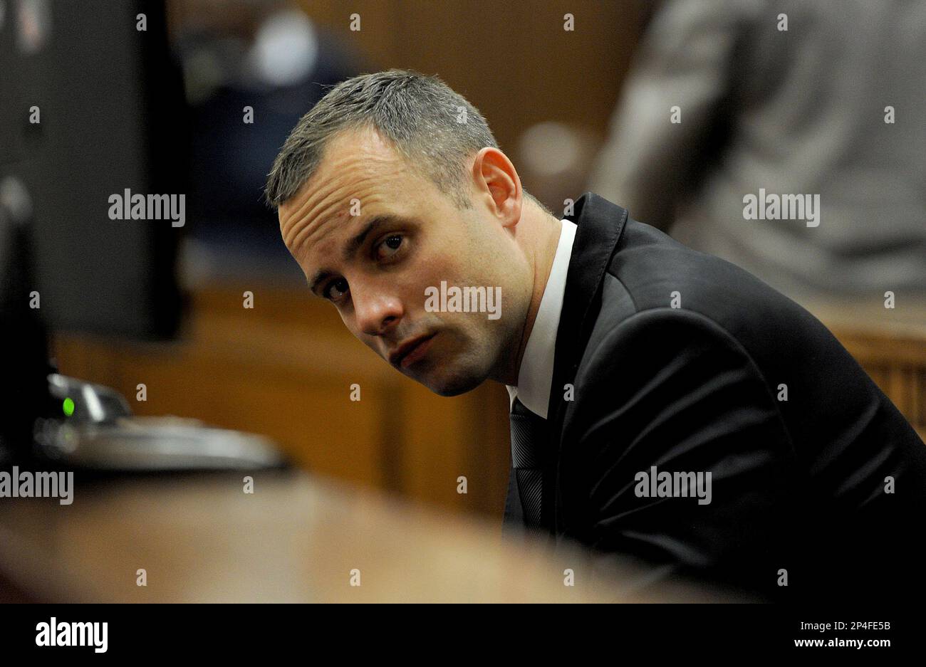 Oscar Pistorius sits in court for his ongoing murder trial in Pretoria ...